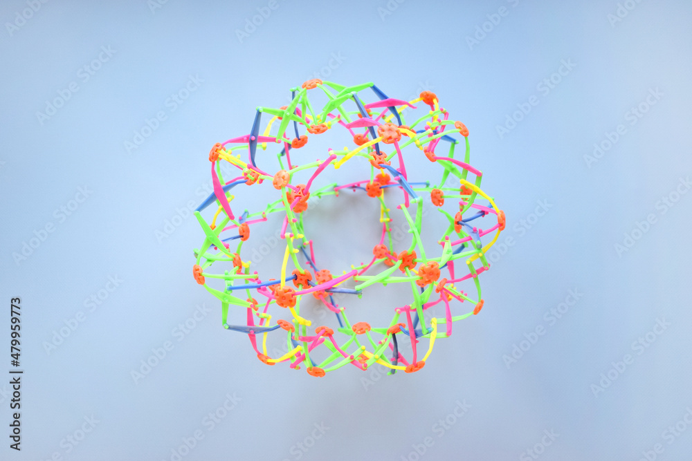 Hoberman sphere. Folding ball of rainbow colors on a light background ...