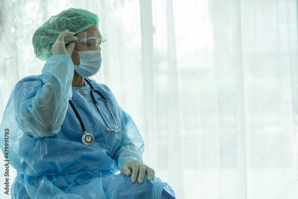 Asian doctor wearing face shield and PPE suit new normal to check ...