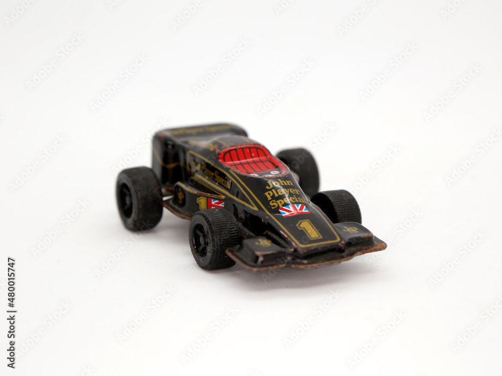 Brass cars. Old formula 1 racing car toy. Advertising and sponsor logos ...