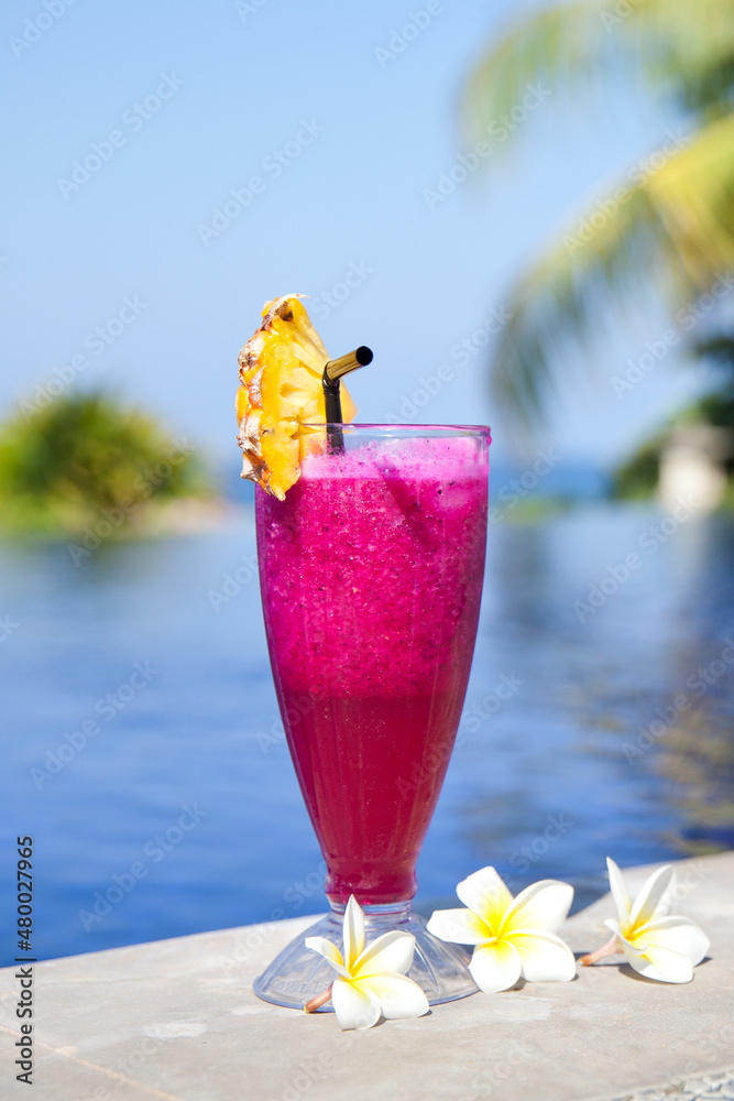 Deliciously punch juice by the swimming pool. A glass of cocktail from ...