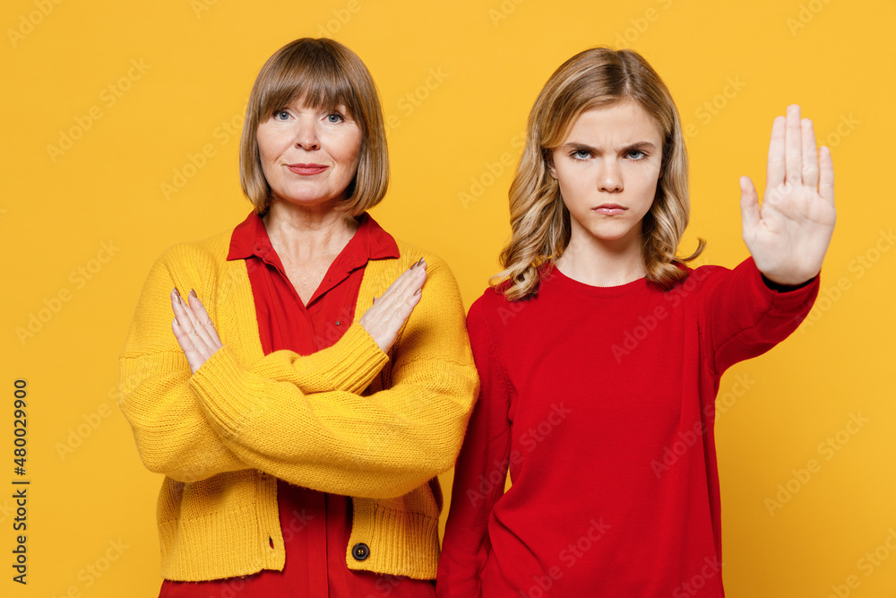 Happy strict woman 50s in red shirt have fun with teenager girl 12-13 ...