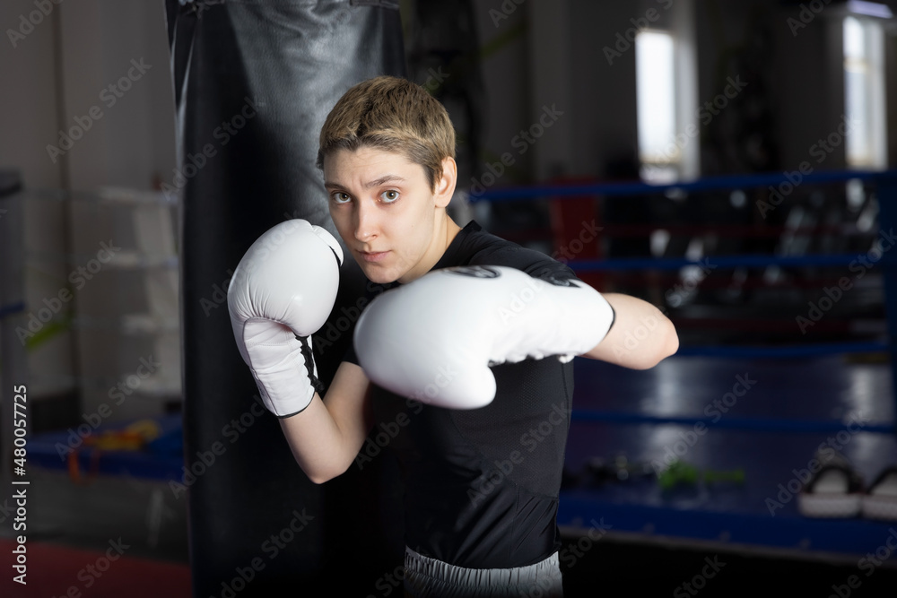 Woman boxer stays in defend a position in the boxing ring Stock Photo ...