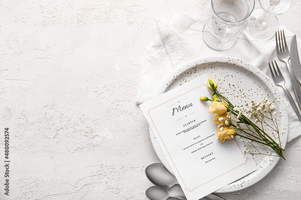 Beautiful table setting with menu and flowers on light background Stock ...