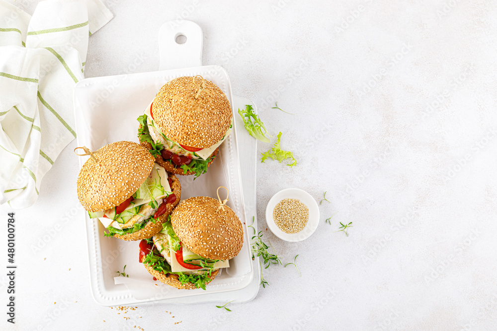 Chicken hamburgers, sandwich with chicken burger, cheese, tomato ...