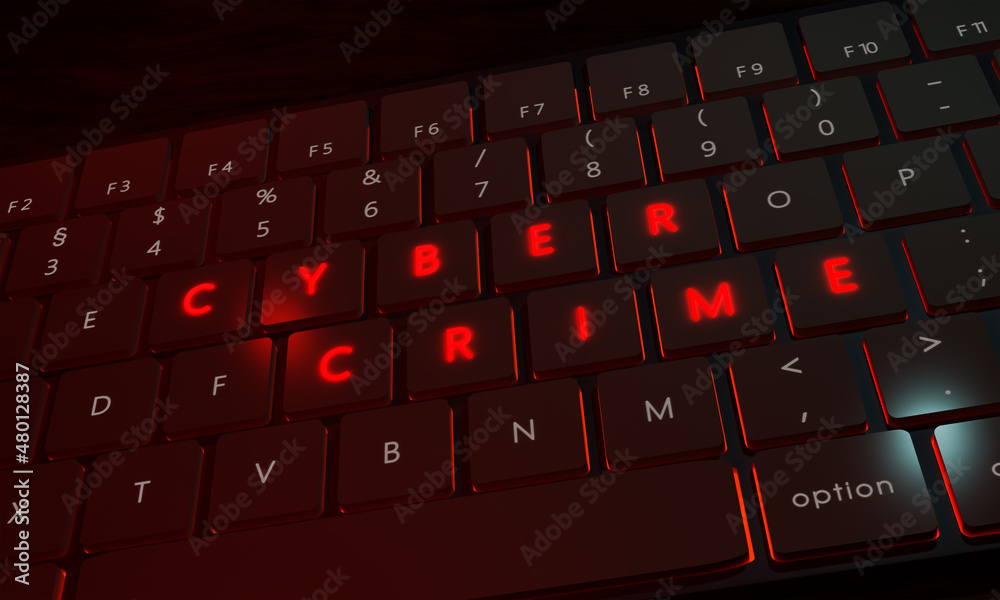 Black computer keyboard. The text Cyber Crime in red illuminated ...