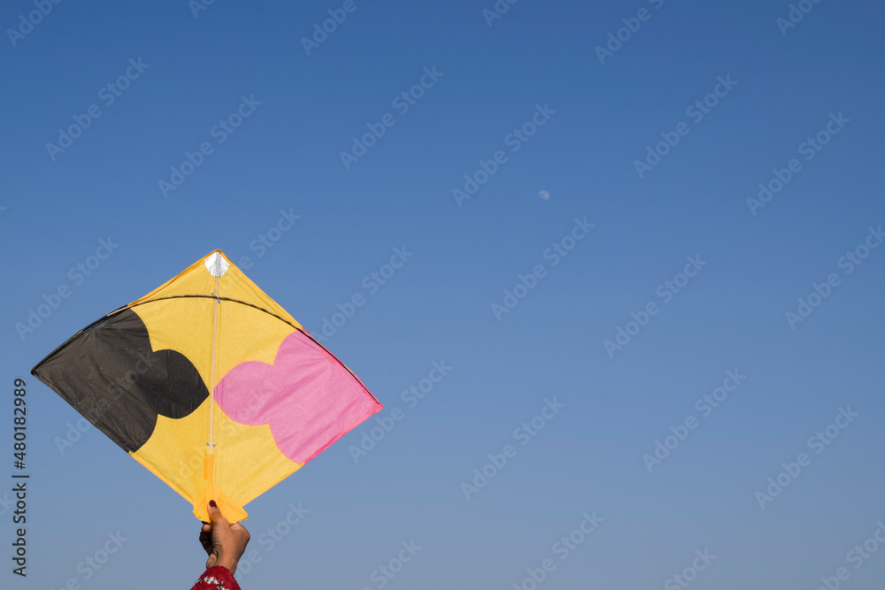 Female flying kite with sky background on occasion of Indian kite ...