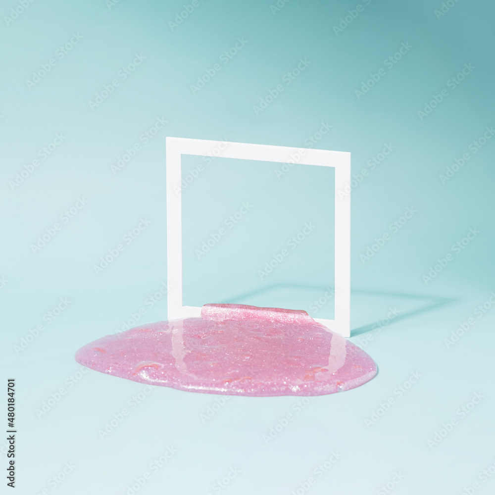 Pink slime spilling out of a square white frame on a pastel blue ...