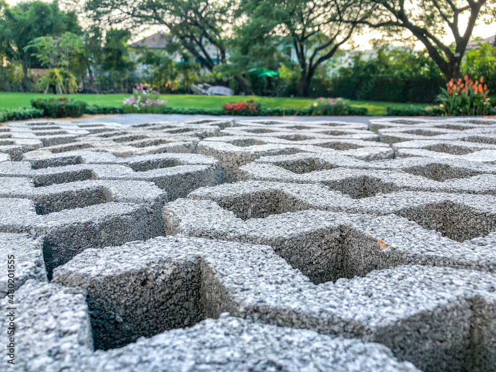 gray color stone brick block floor tile with green grass and sand as ...