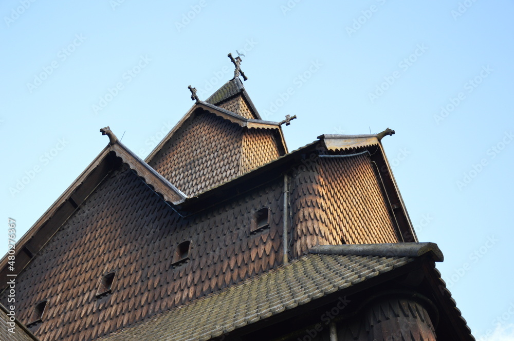 Medieval wooden stave church in Heddal, Norway. Carved wooden dragon ...