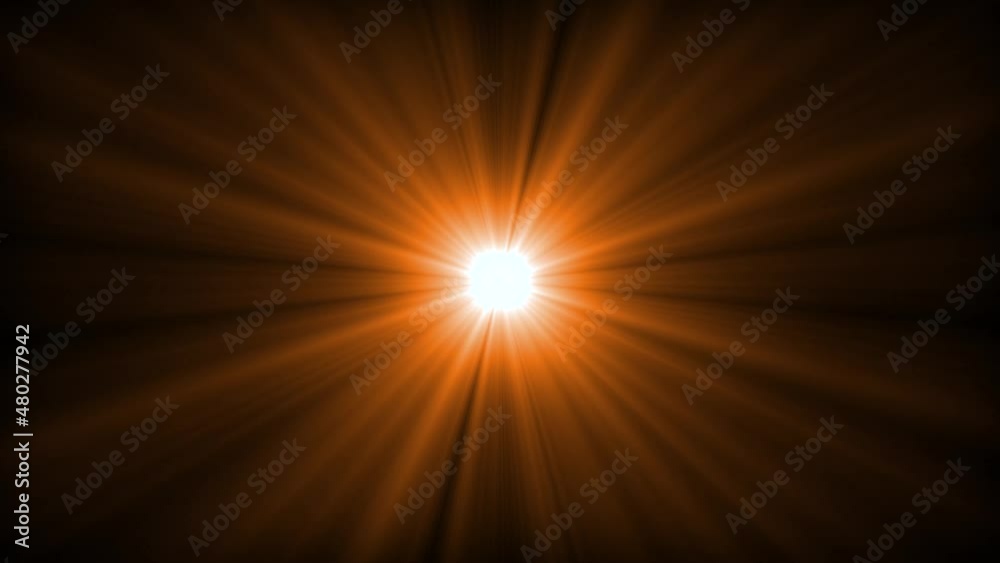 Bright light in the centre of frame with light rays glistening on the ...