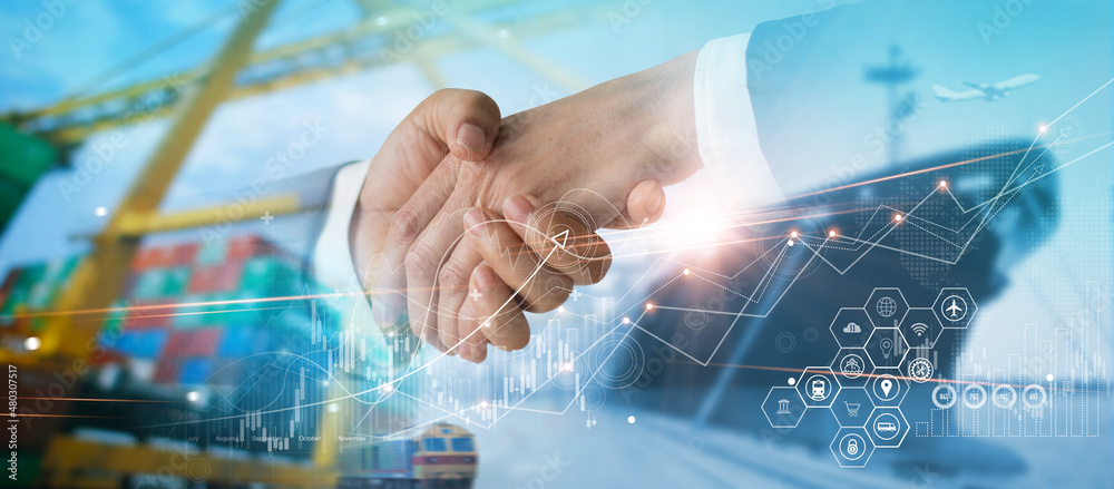 Successful logistic and transportation deal. Businessmen handshake for ...