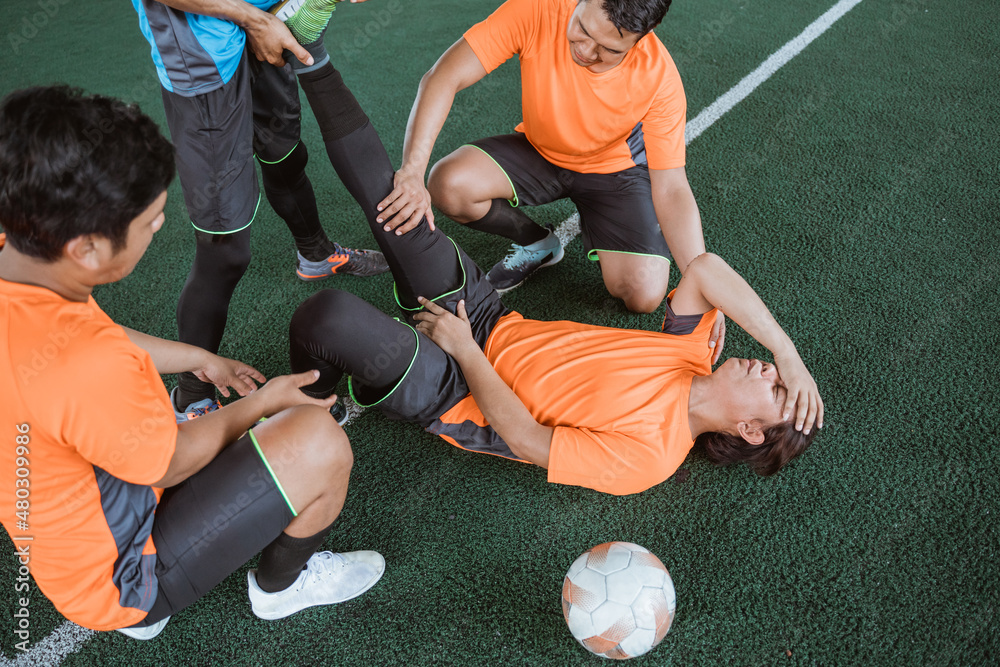 Futsal players are in pain because of leg injuries Stock Photo | Adobe ...