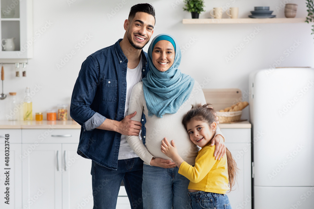 Islamic Expecting Family. Happy Pregant Muslim Woman Posing With ...