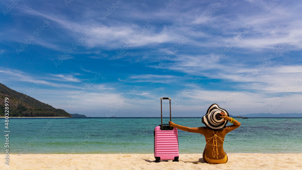Back view of young woman in bikini with the vacation in a holiday on ...