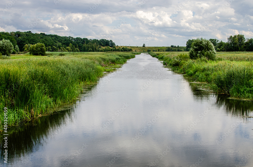 Old Russian water channel where grass grows along the edges Stock Photo ...