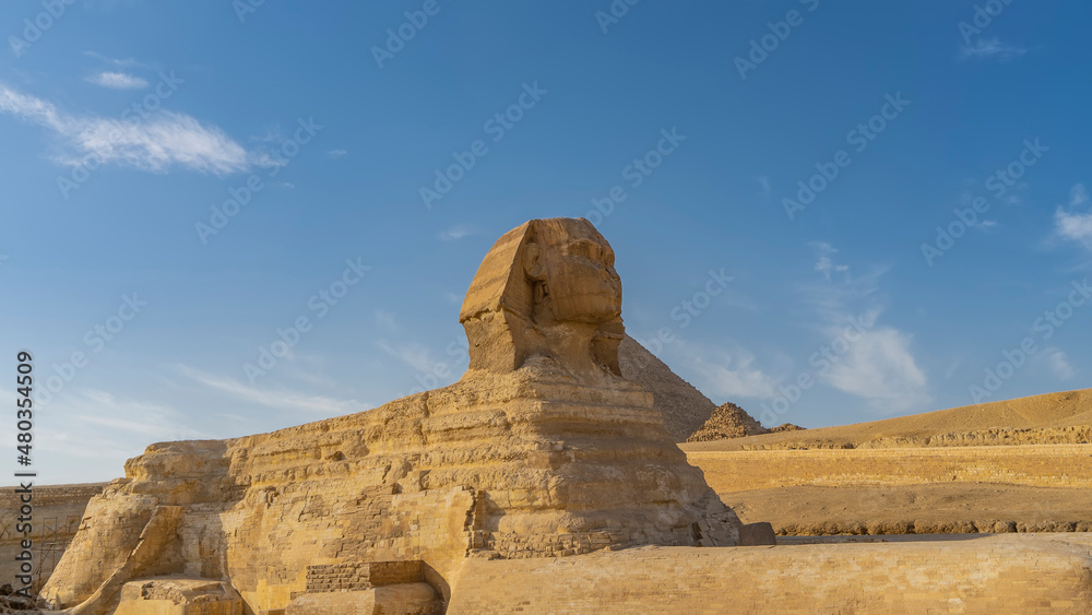 The famous statue of the Great Sphinx on a background of blue sky and ...