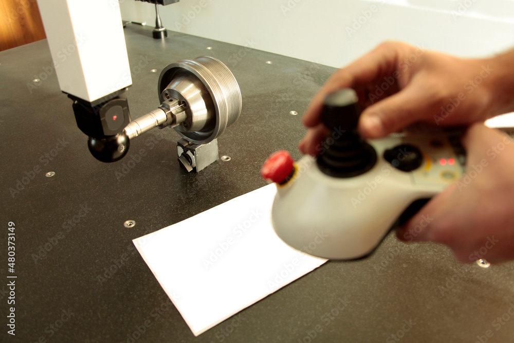 CMM probe measuring on steel cylinder. CMM probe Machine control ...