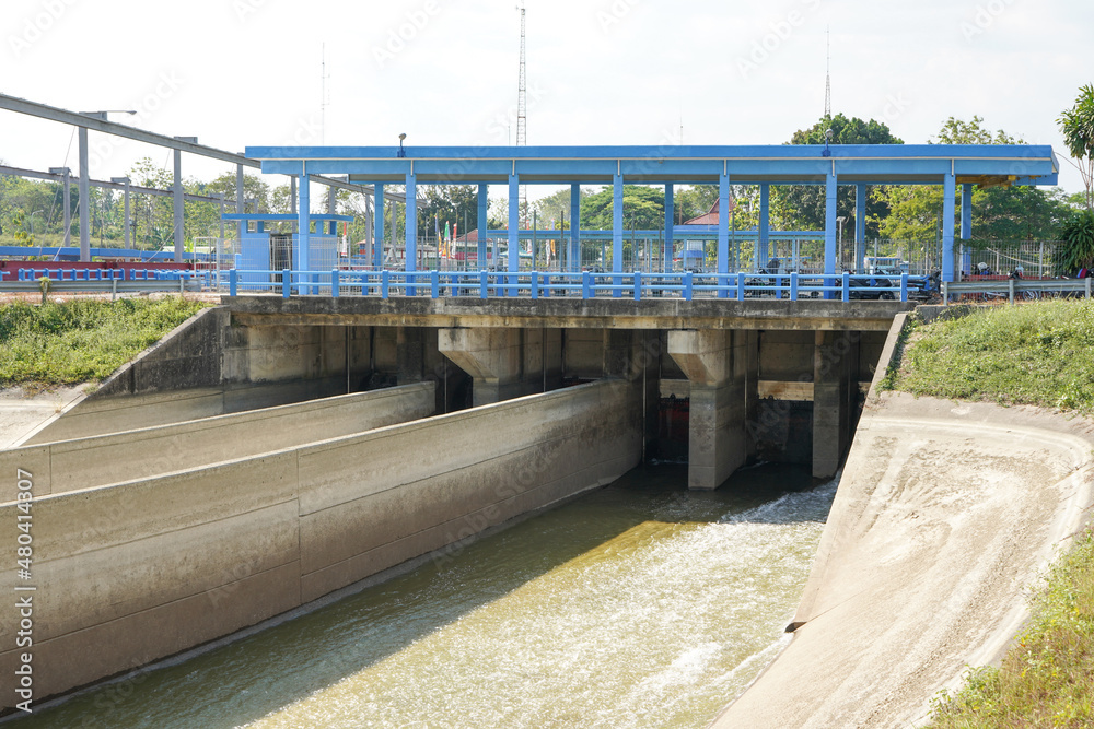 The water flow channel from the dam which is flowing with very heavy ...
