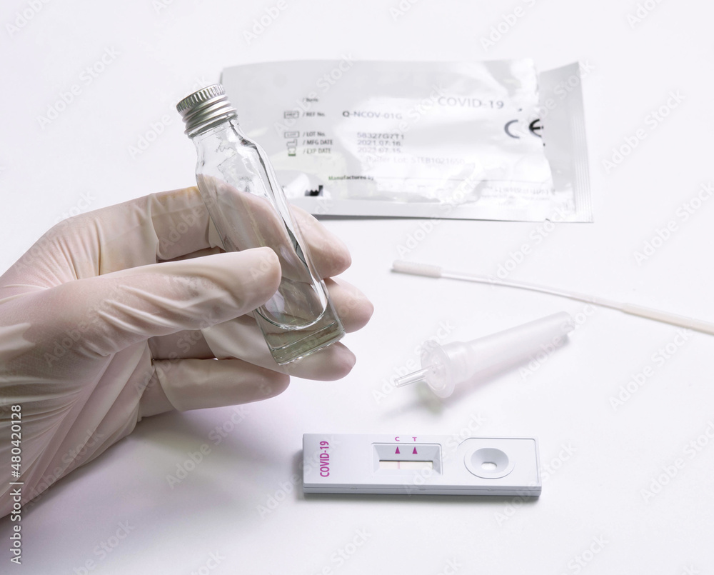 Doctor holding a COVID-19 test kit Test results are negative, not ...
