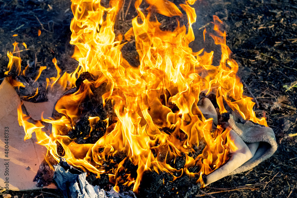 Burning old clothes after an infectious disease Stock Photo | Adobe Stock