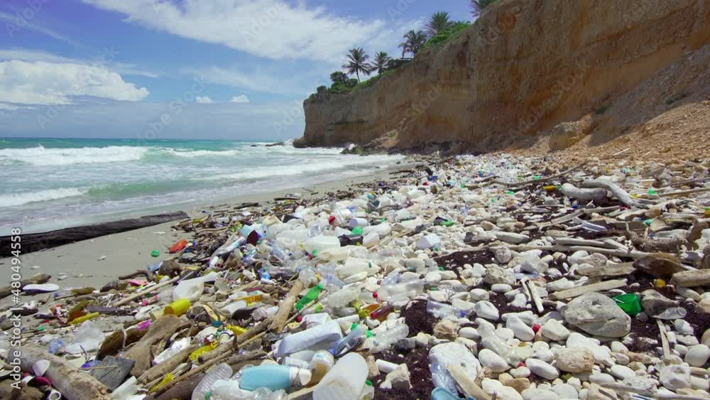 Plastic waste on the sandy beach of the Dominican Peninsula. Garbage ...