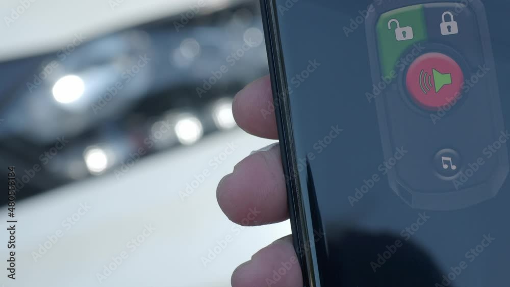 Unlock and lock Car Using Smartphone App. Man hand Unlocking car by use ...