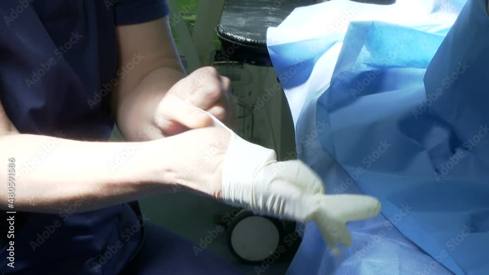 Doctor or nurse worker surgeon preparing for the surgical operation and ...