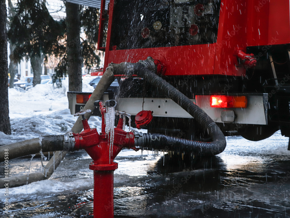 Fire truck refueling on a hydrant during a fire Stock Photo | Adobe Stock