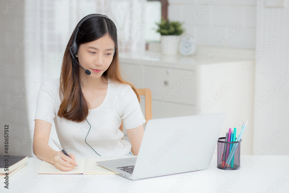 Young asian woman wearing headphone study online with e-learning on ...