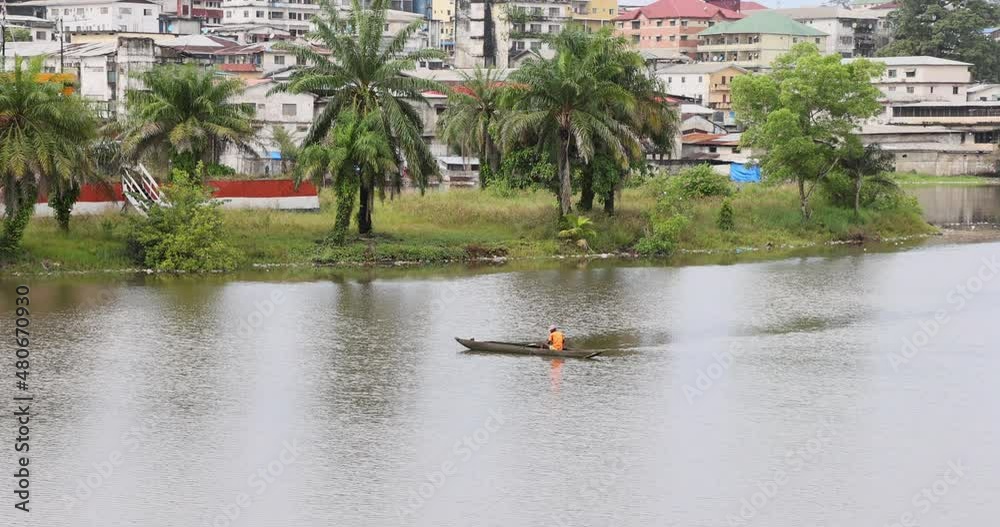 Dugout wood canoe ocean bay Monrovia Liberia. Coast of west Africa ...