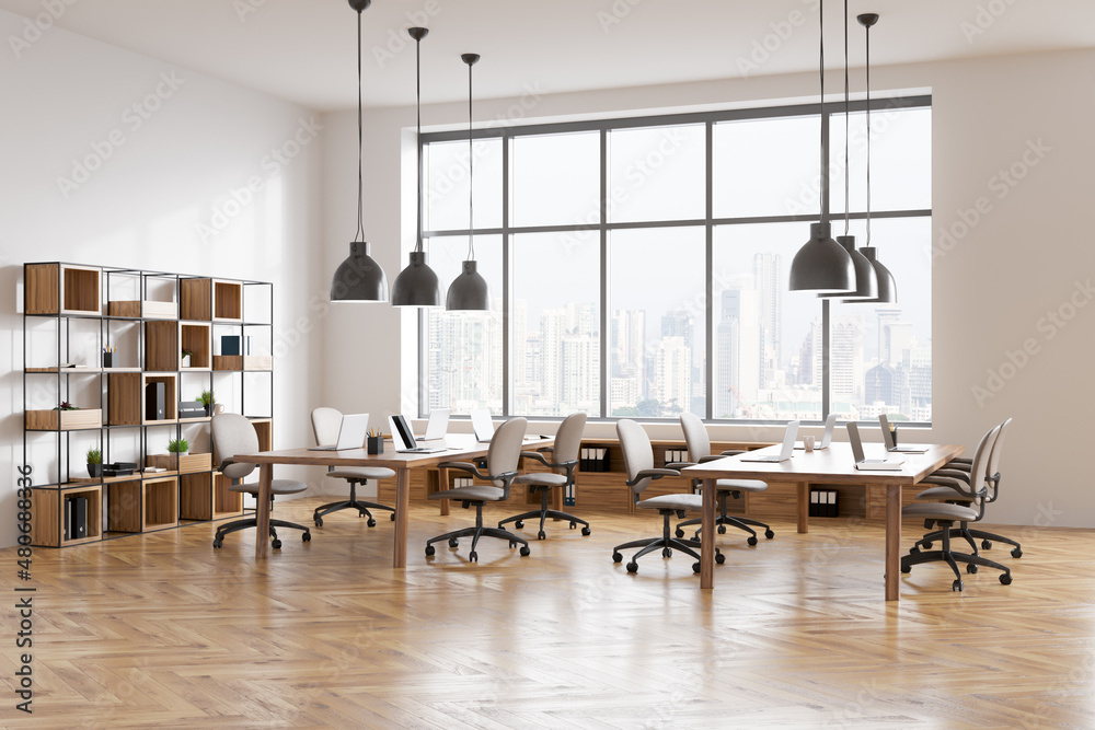 Light business room interior with seats, table with laptop, window with ...