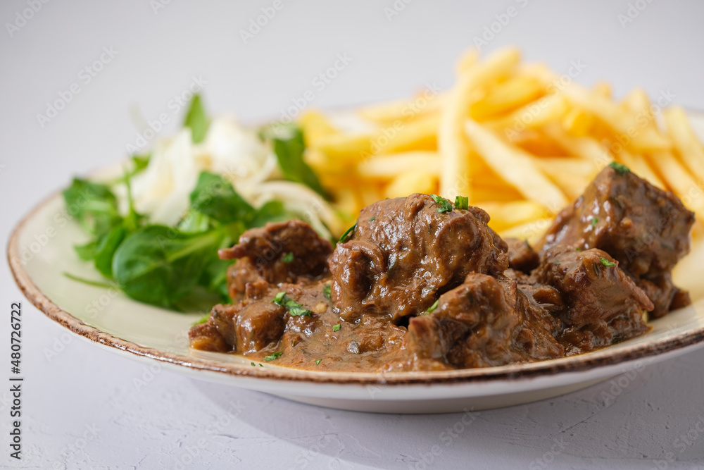 Belgian Beef stew with french fries Stock Photo | Adobe Stock