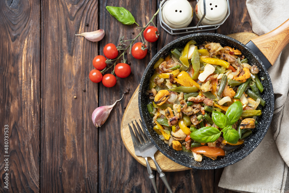 Seafood ragout, healthy mediterranean dinner. Seafood shrimps, calamari ...