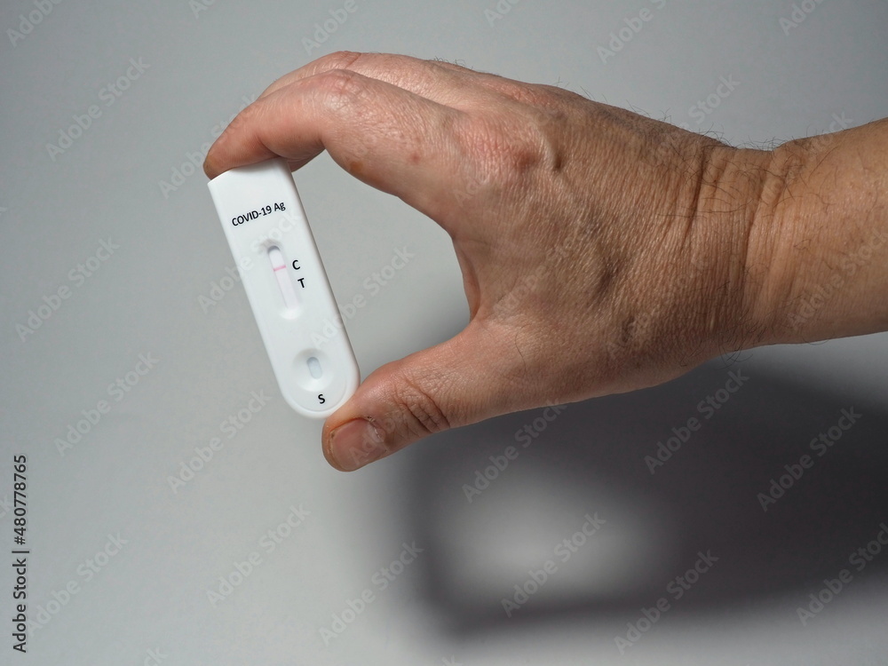 Hand holding a rapid test device for COVID-19. Test for coronavirus in ...