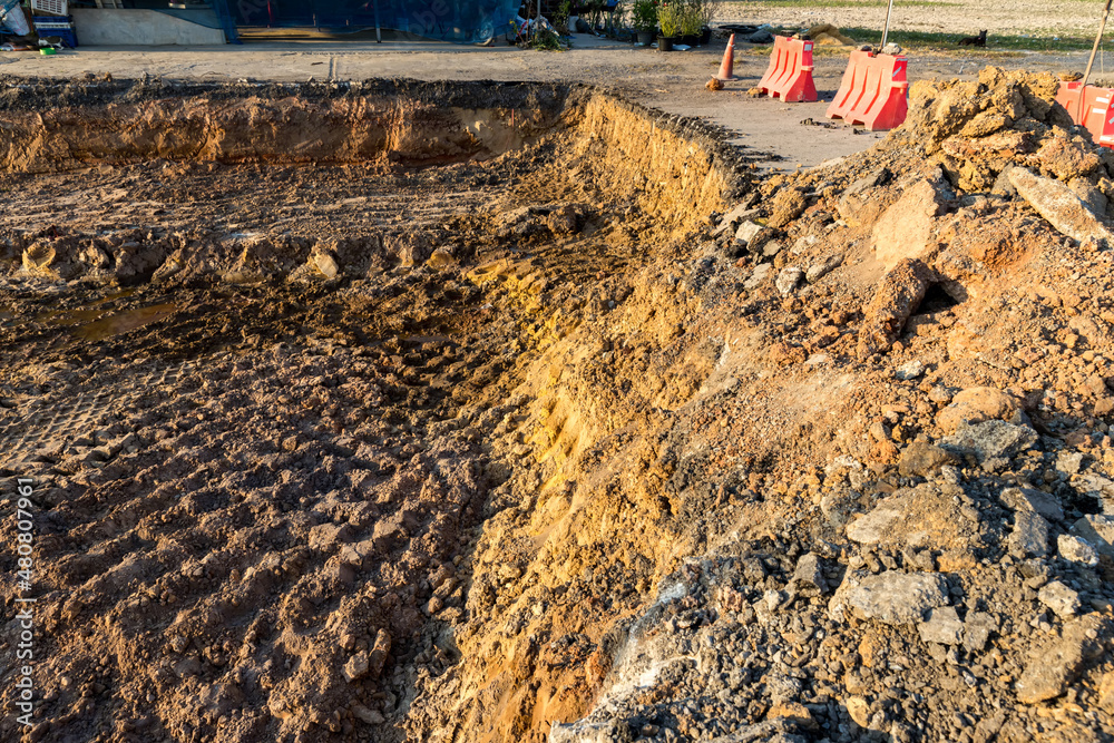 Side of the broken asphalt road collapsed and fallen. Road collapses ...