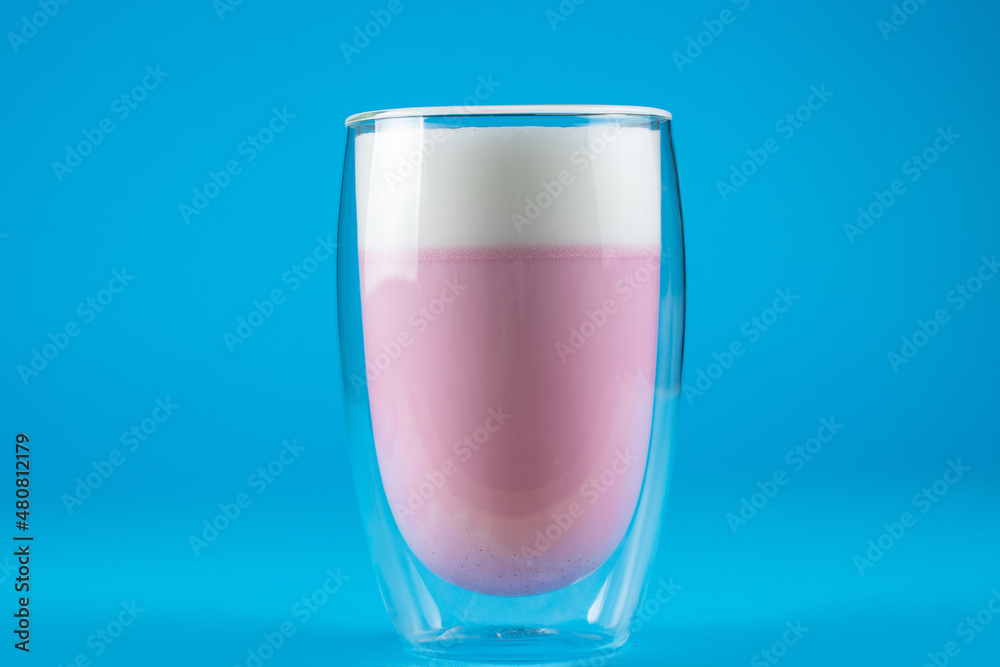 Pitahaya pink matcha on blue background. Matcha from dragon fruit ...