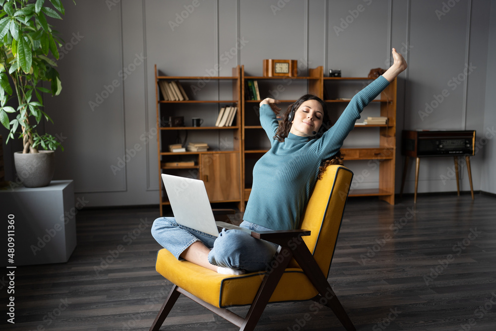 Happy office-based female employee trying to adapt to remote work from ...