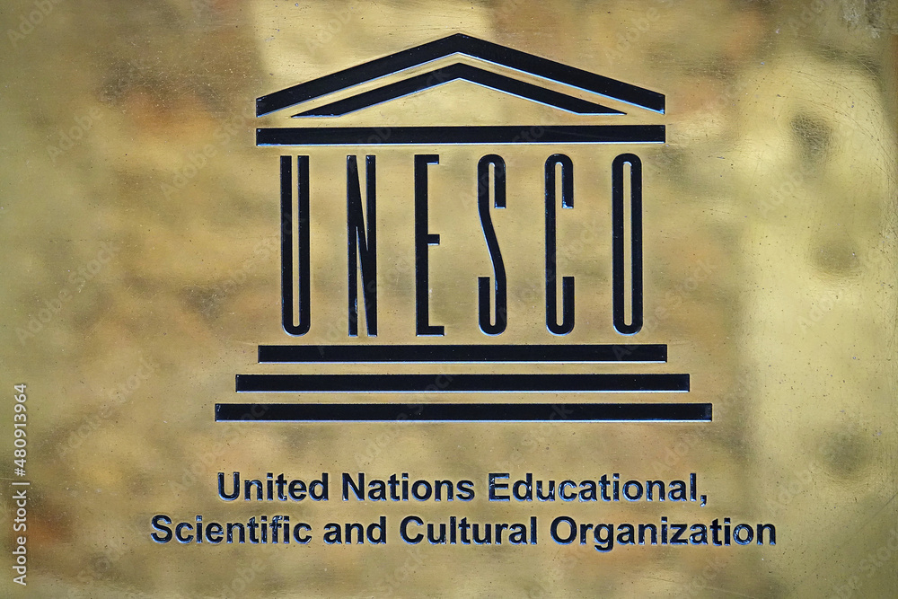 UNESCO logo on brass plate. UNESCO, the United Nations Educational ...