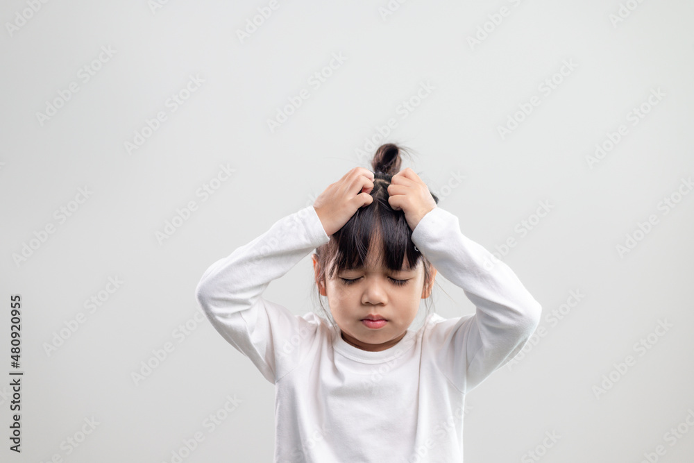 Sad little girl holds his head. little girl feeling sick, having ...