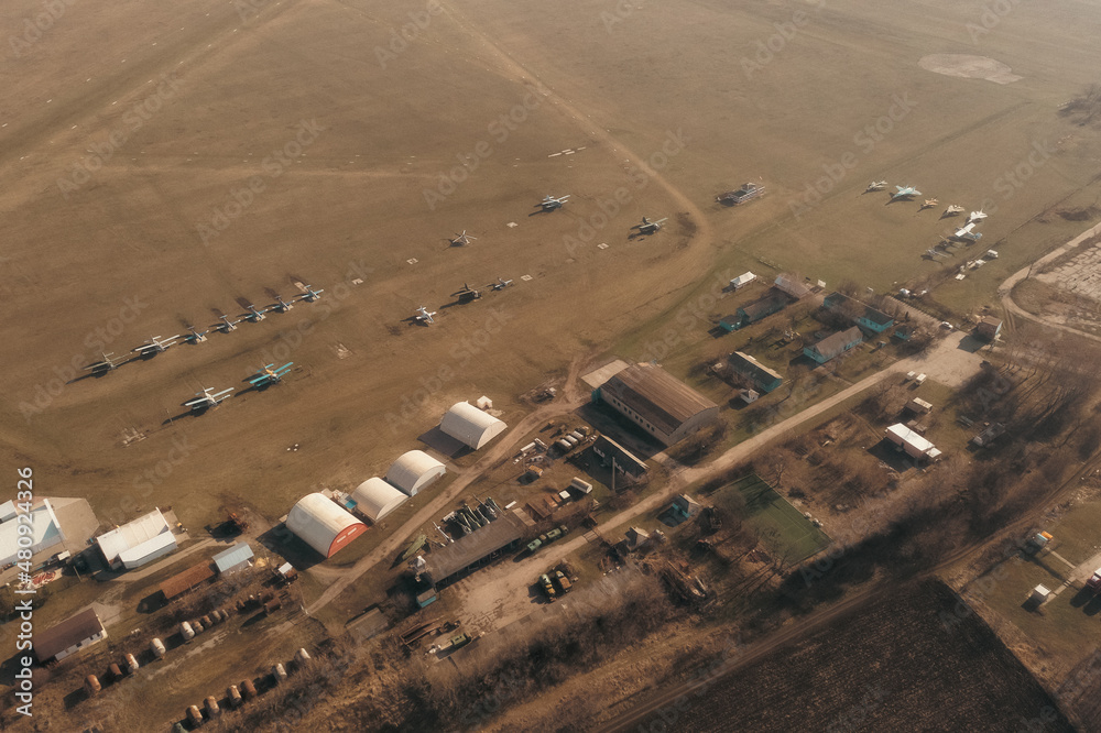 Sports airfield with planes and helicopters near the runway - aerial ...