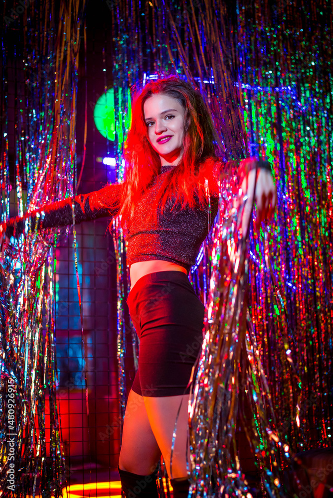 Disco dancer in neon light. Fashion model woman in neon light, portrait ...