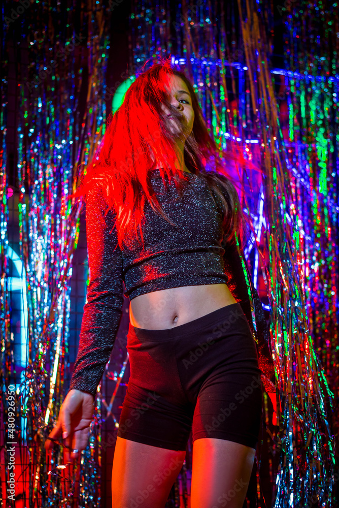 Disco dancer in neon light. Fashion model woman in neon light, portrait ...