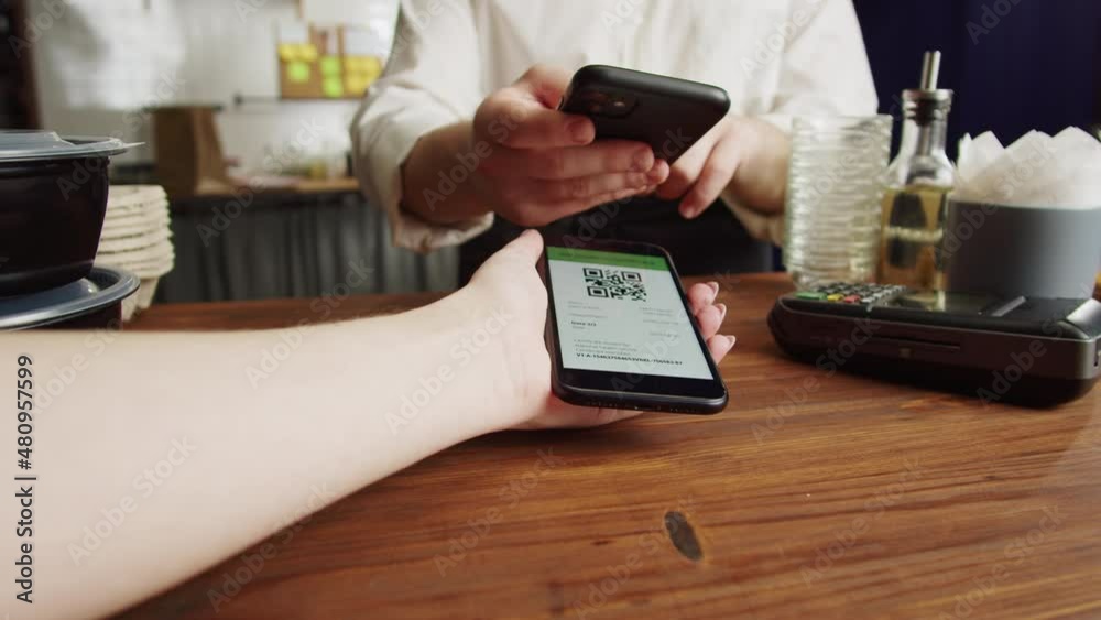 QR code, covid vaccination passport control close-up. Scanning ...