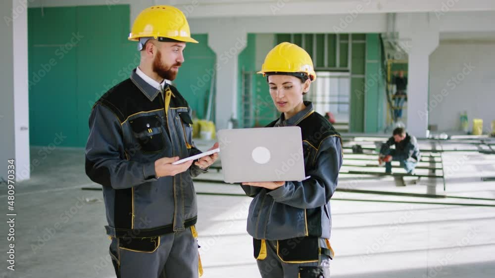 Charismatic woman engineer inside of construction building analysing ...