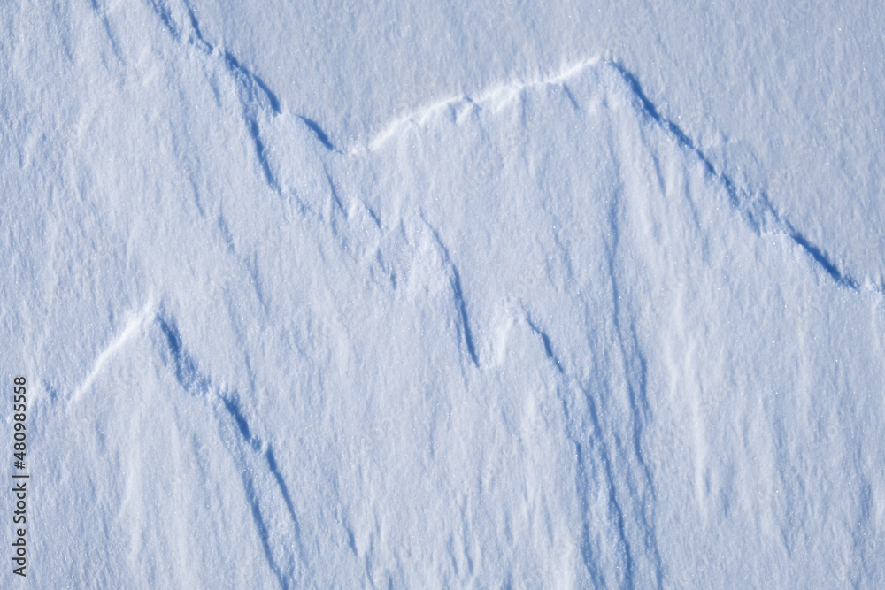 Natural snow background with drawings of mountains made by the w Stock ...