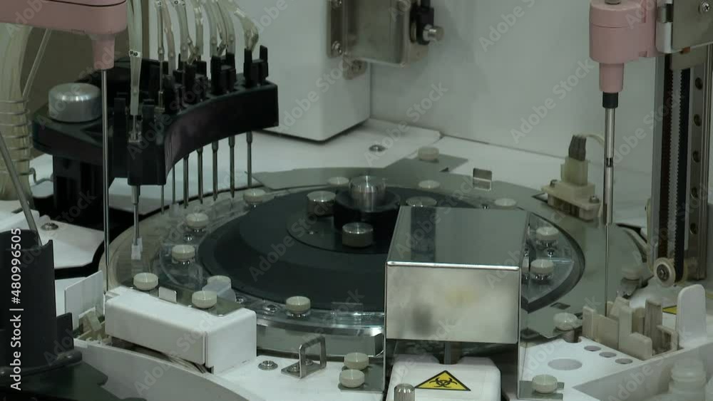 Healthcare concept. Clinical blood chemistry analyzer at work ...