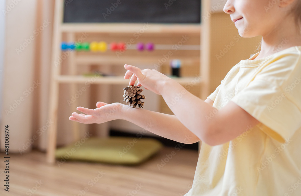 Child make exercise with relief cone for tactile sensory. Stock Photo ...