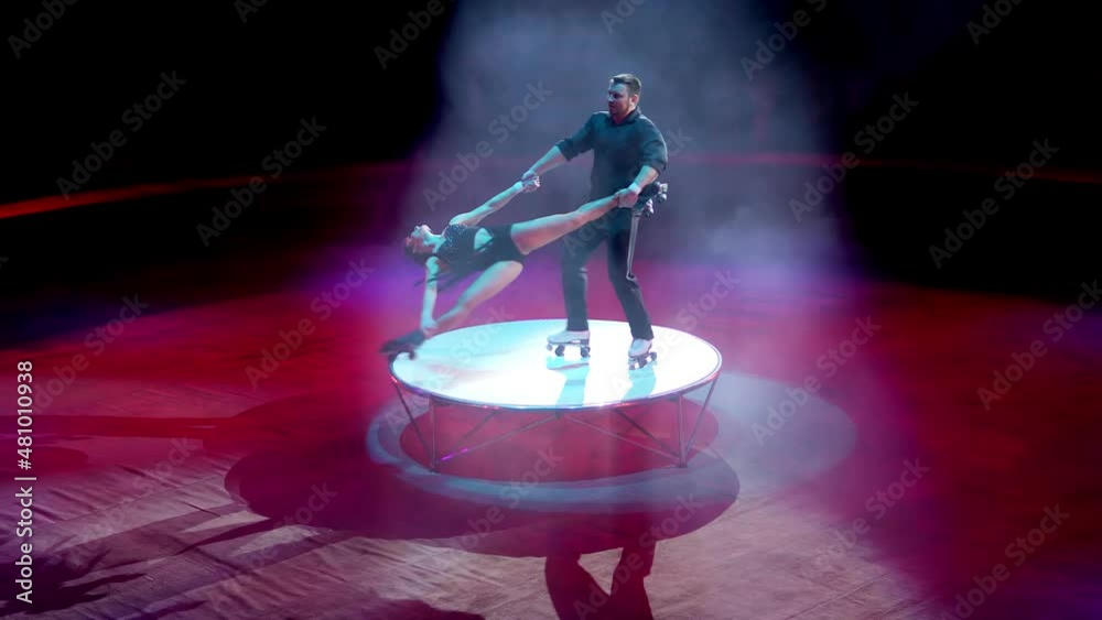 A duo of gymnasts arrange acrobatic performances on roller skates, on ...