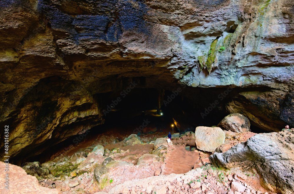 Scenic wide-angle landscape view of mysterious cave. Cennet and ...