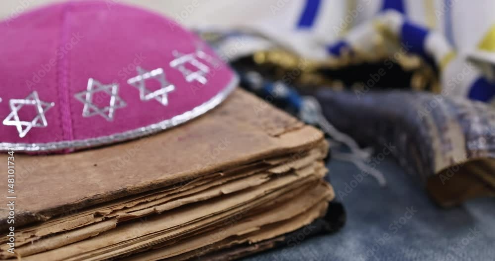 Jewish prayer items tallit and kippa on a shofar prayer book of torah ...